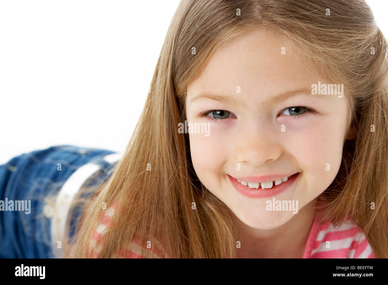 Studio Portrait of Smiling Girl Stock Photo - Alamy