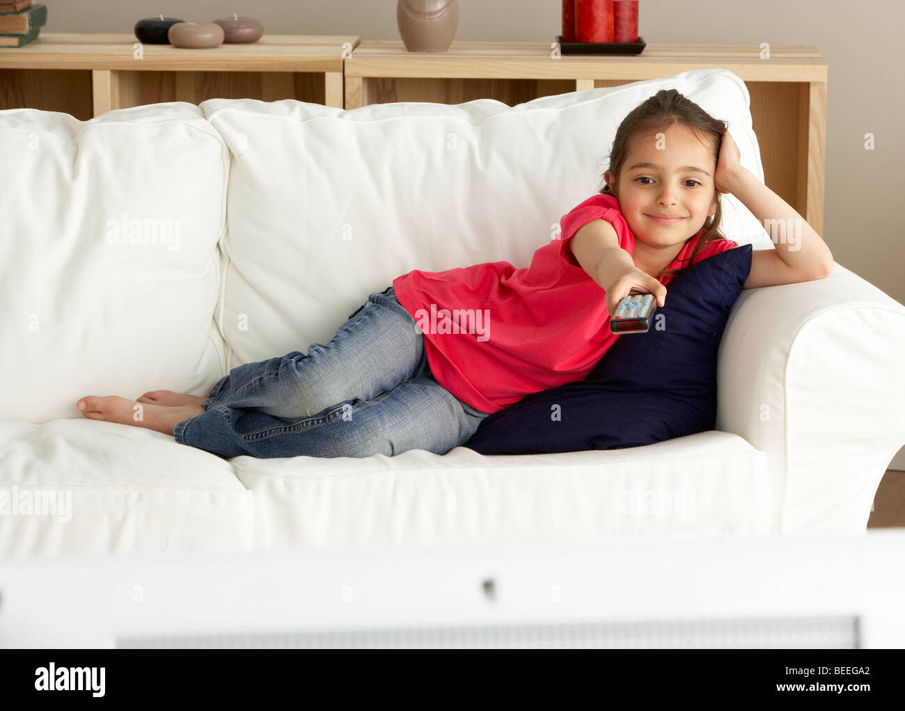 Young Girl Watching Television at Home Stock Photo - Alamy