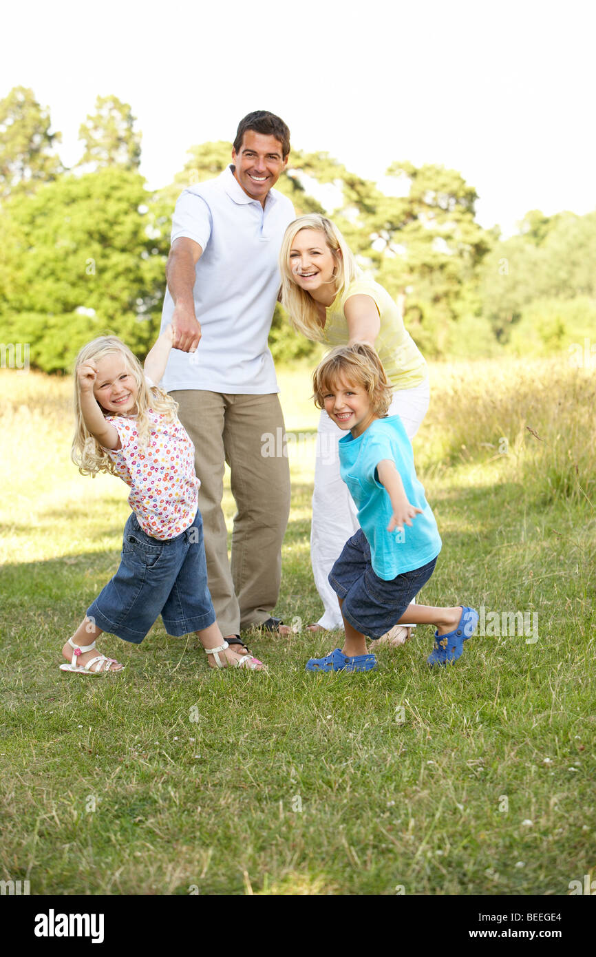Family having fun in countryside Stock Photo - Alamy