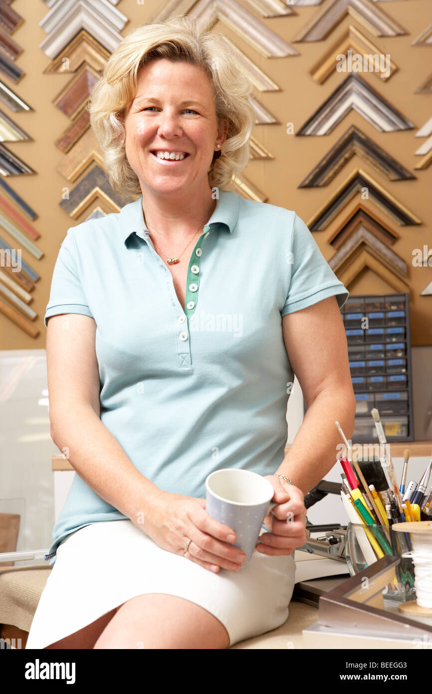 Female picture framer at work Stock Photo - Alamy