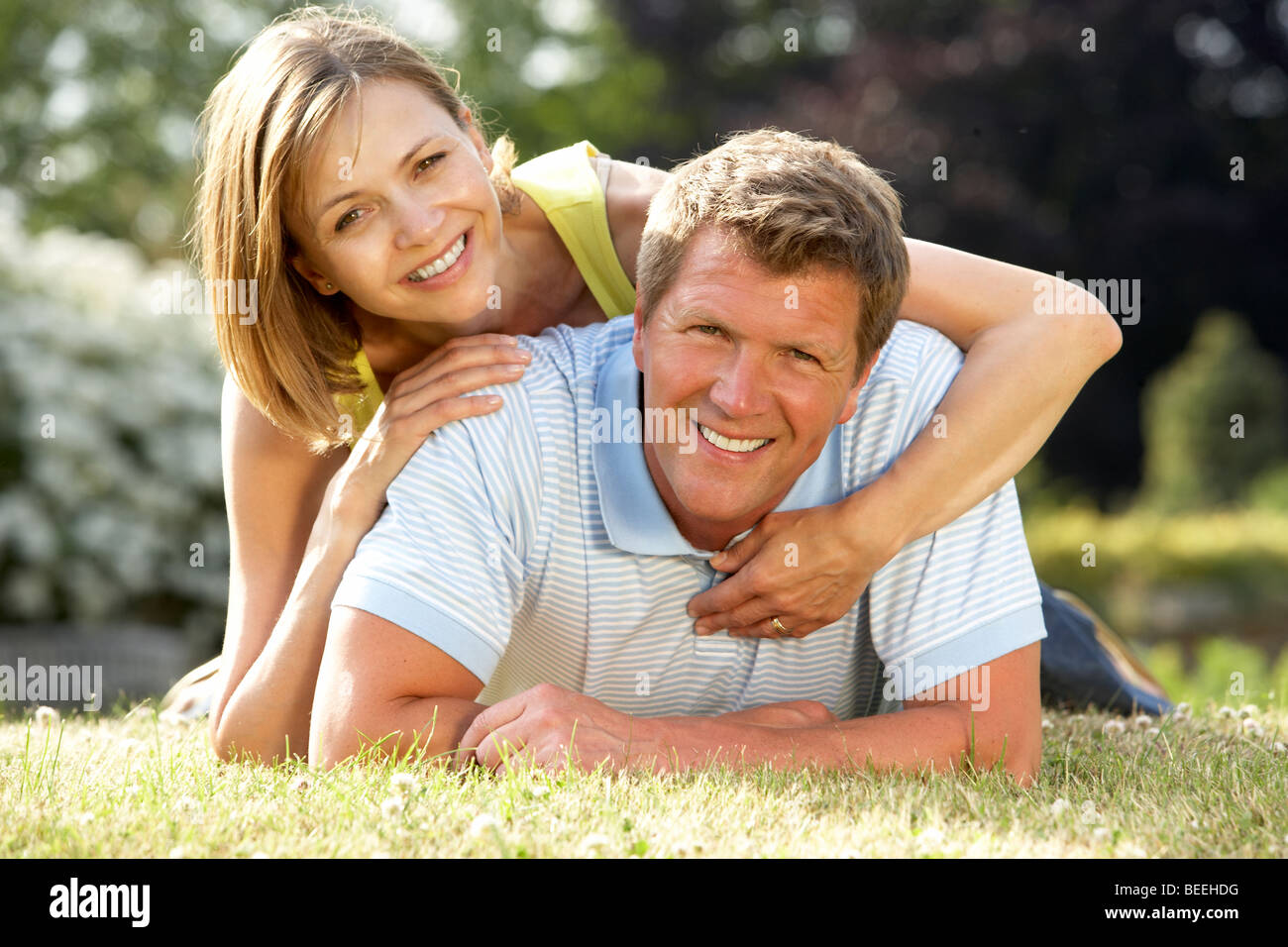 Young couple having fun in countryside Stock Photo - Alamy