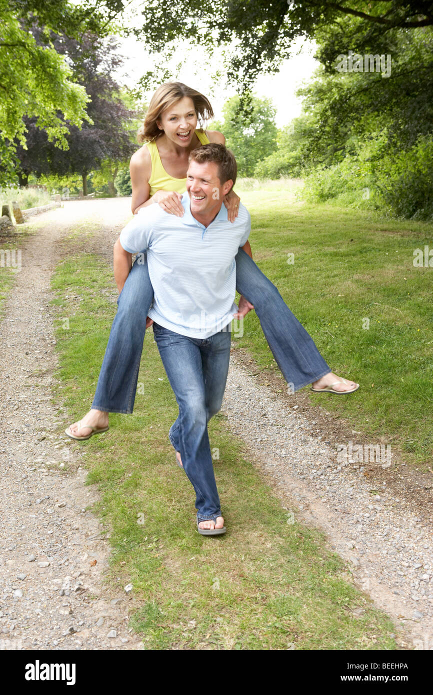 Young couple having fun in countryside Stock Photo - Alamy