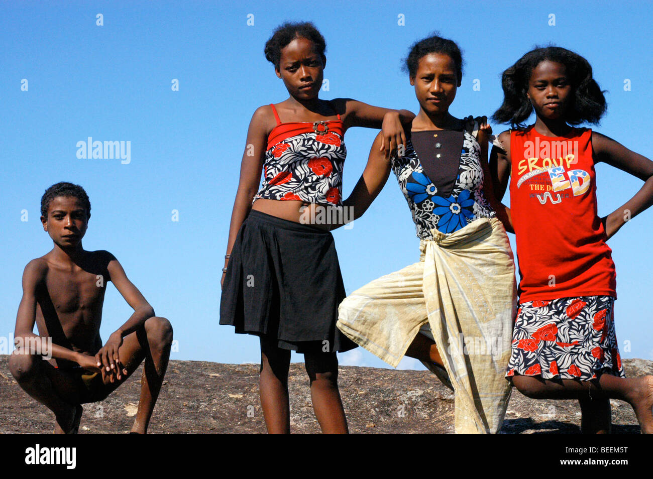 Madagascar - Group of friends pose for photos on rocks near Sainte-Luce ...
