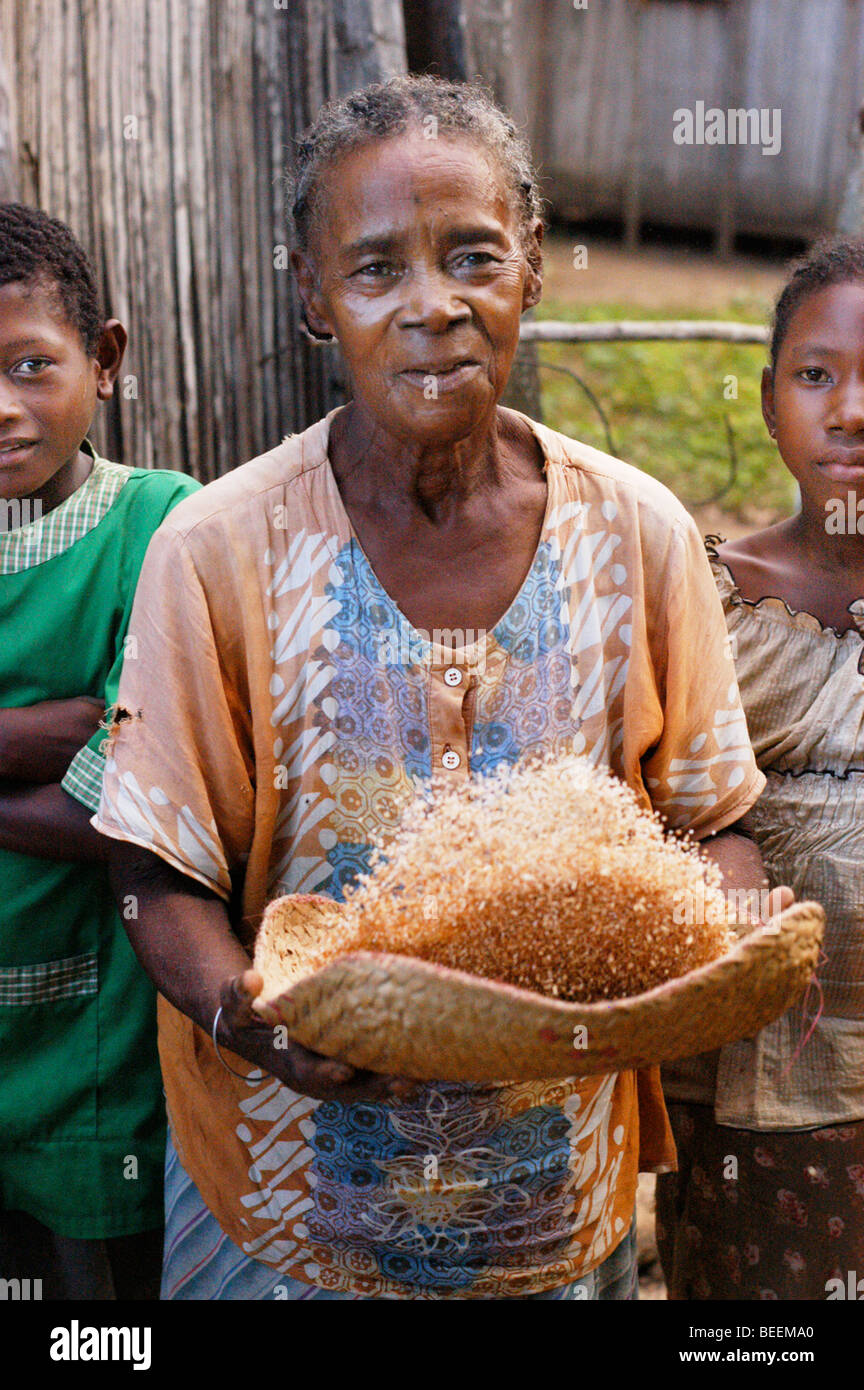 Madagascar - Woman cleaning rice for her family in Ebakika Village ...