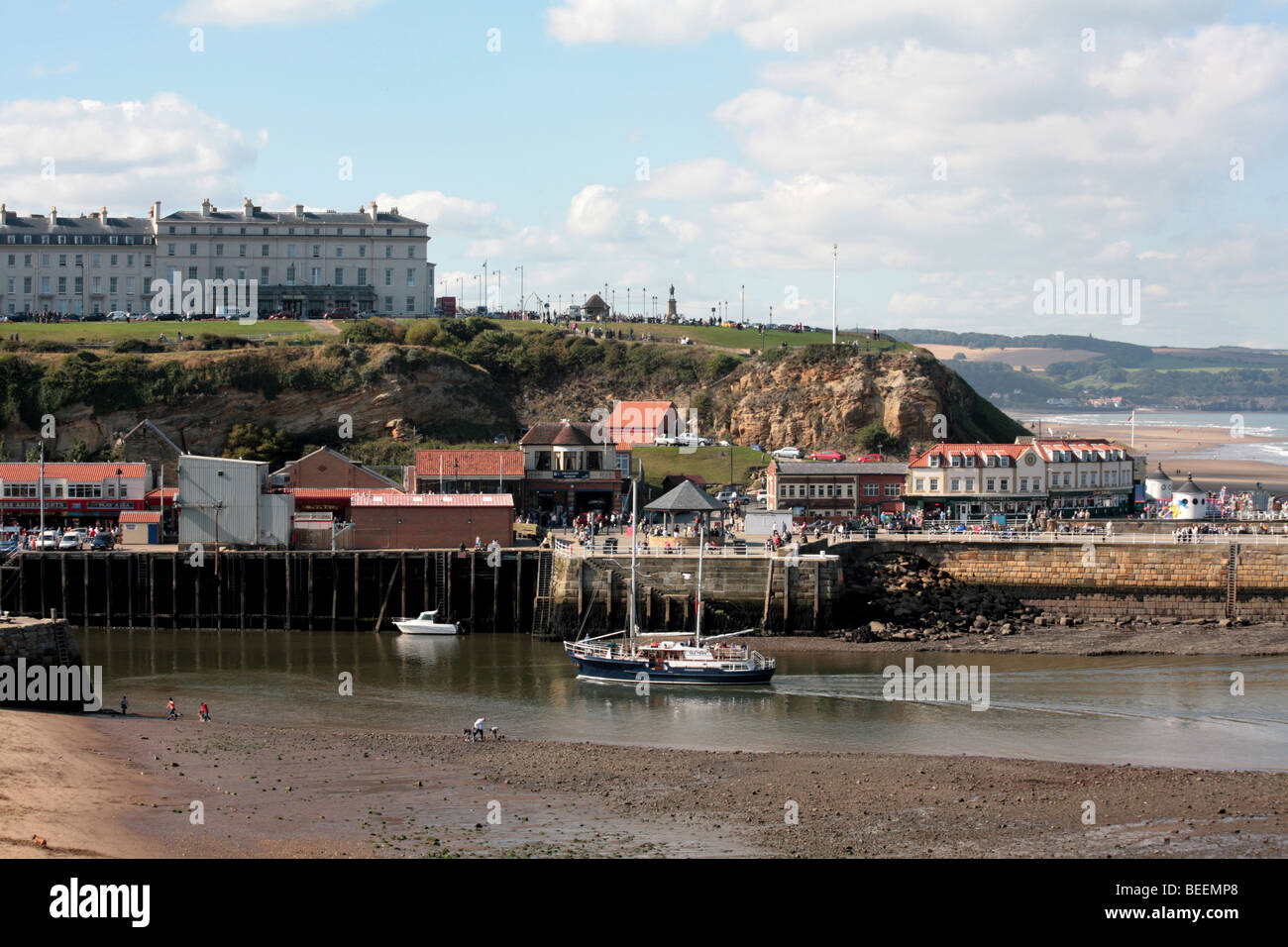 Shops and cafes at the end of Pier Road, sailing boat entering the ...