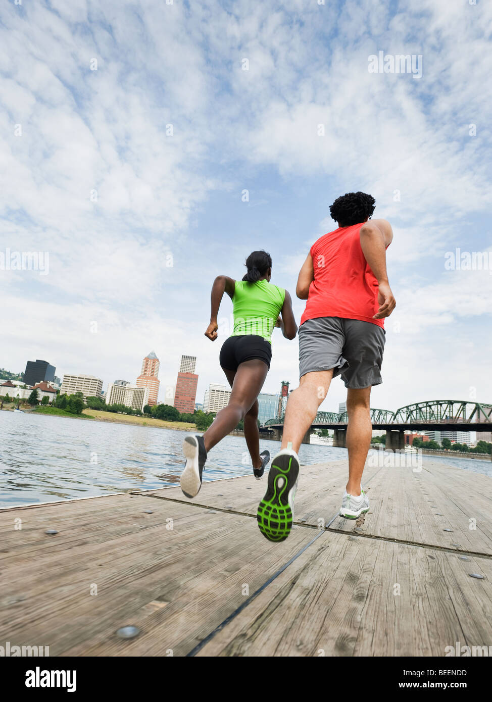 Man woman running along city hi-res stock photography and images - Alamy