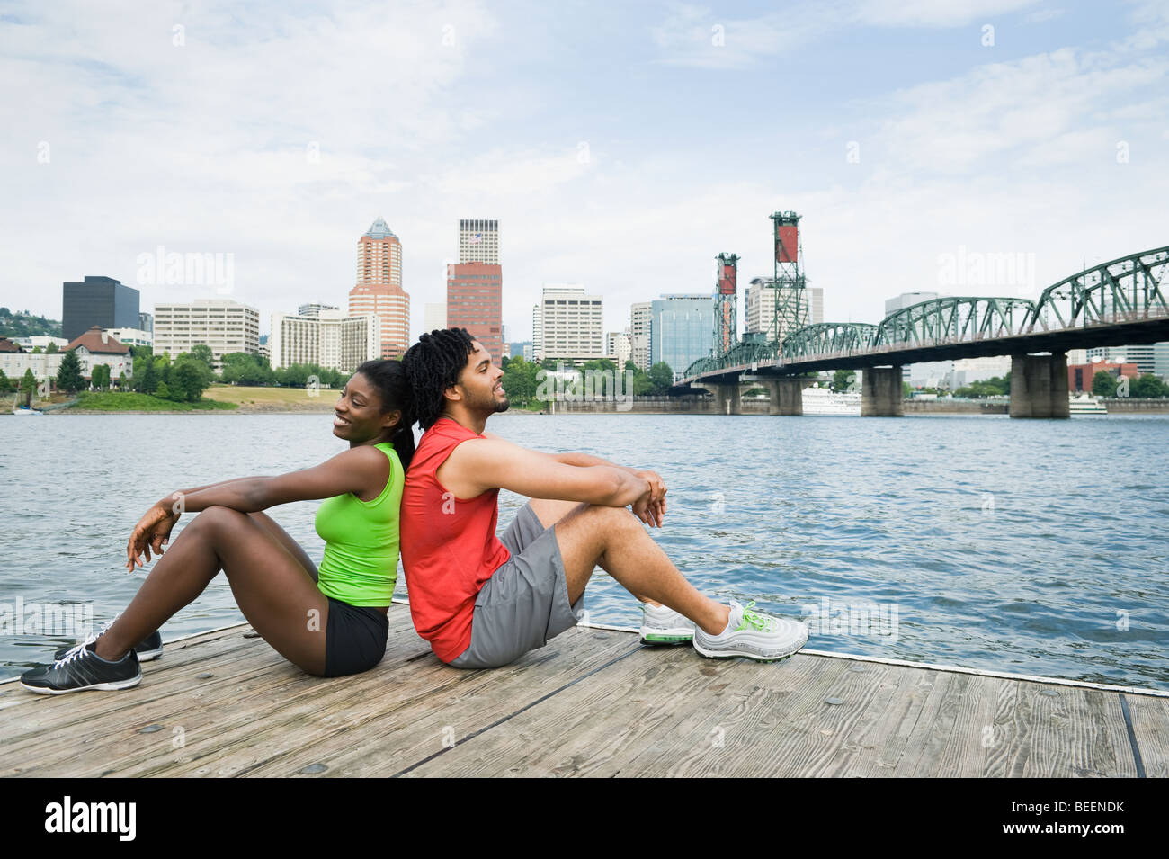 Woman sitting along river hi-res stock photography and images - Alamy