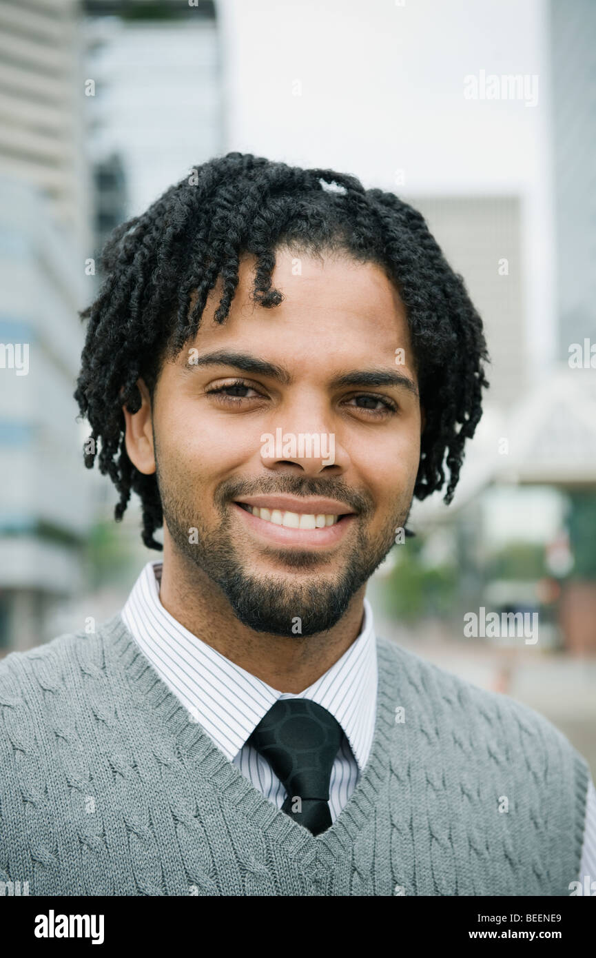 Mixed race businessman smiling Stock Photo - Alamy