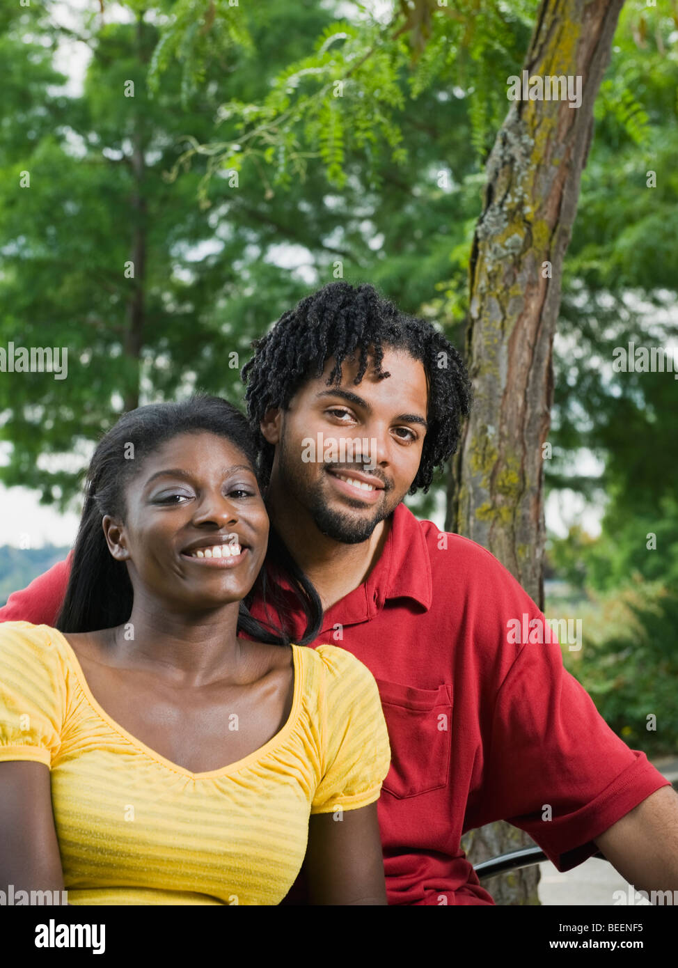 Portrait couple sitting together tree hi-res stock photography and ...