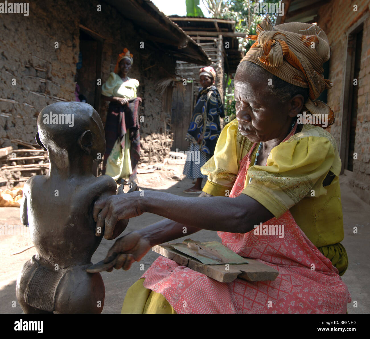 Bakonzo woman making statue out of clay, Rwenzori Mountains, West ...