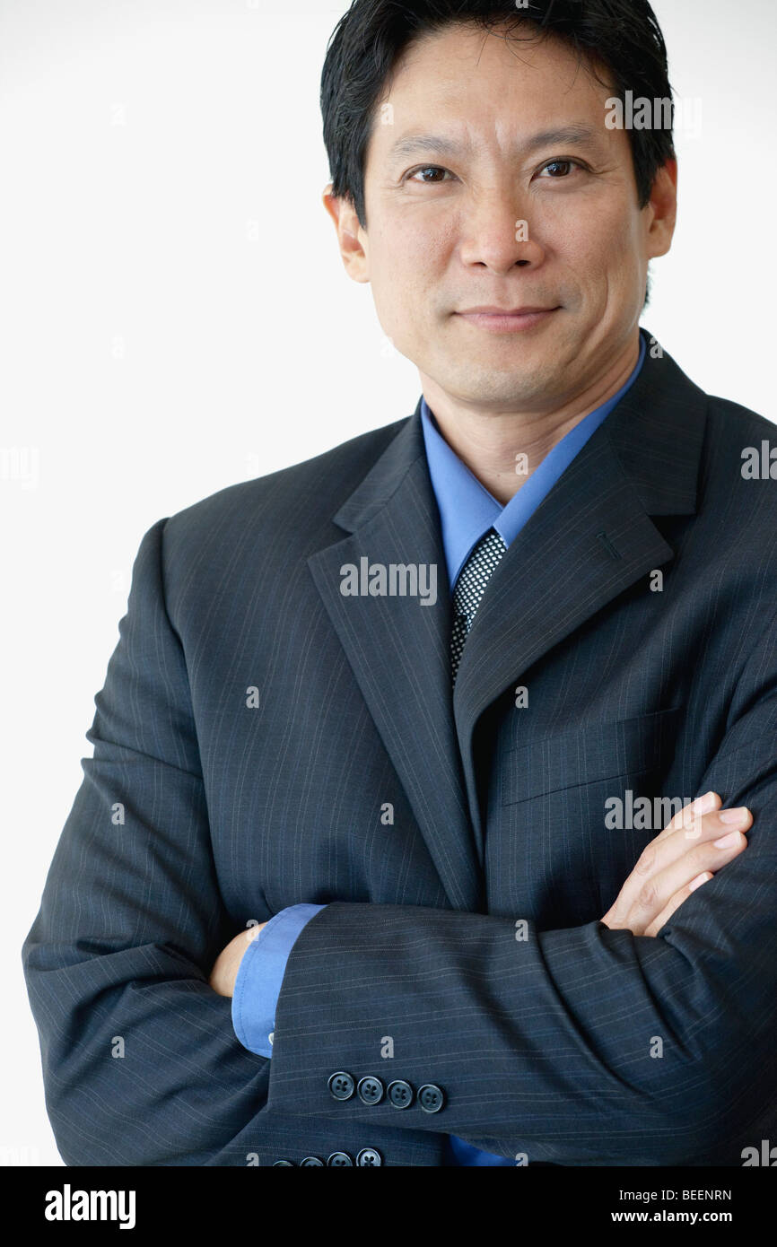 Japanese businessman with arms crossed Stock Photo - Alamy