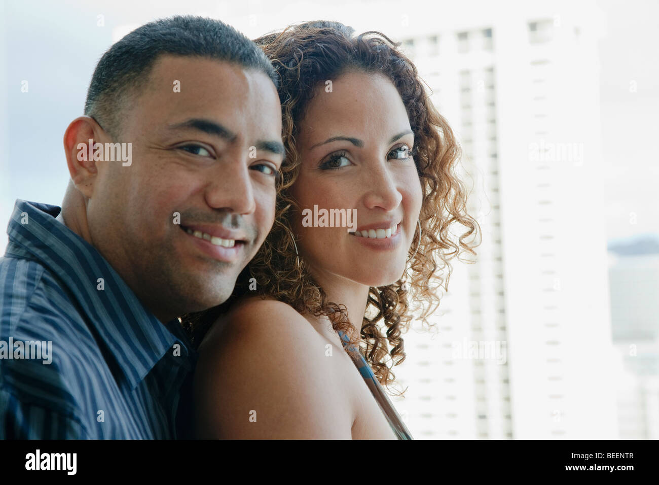 Couple hugging and smiling Stock Photo - Alamy