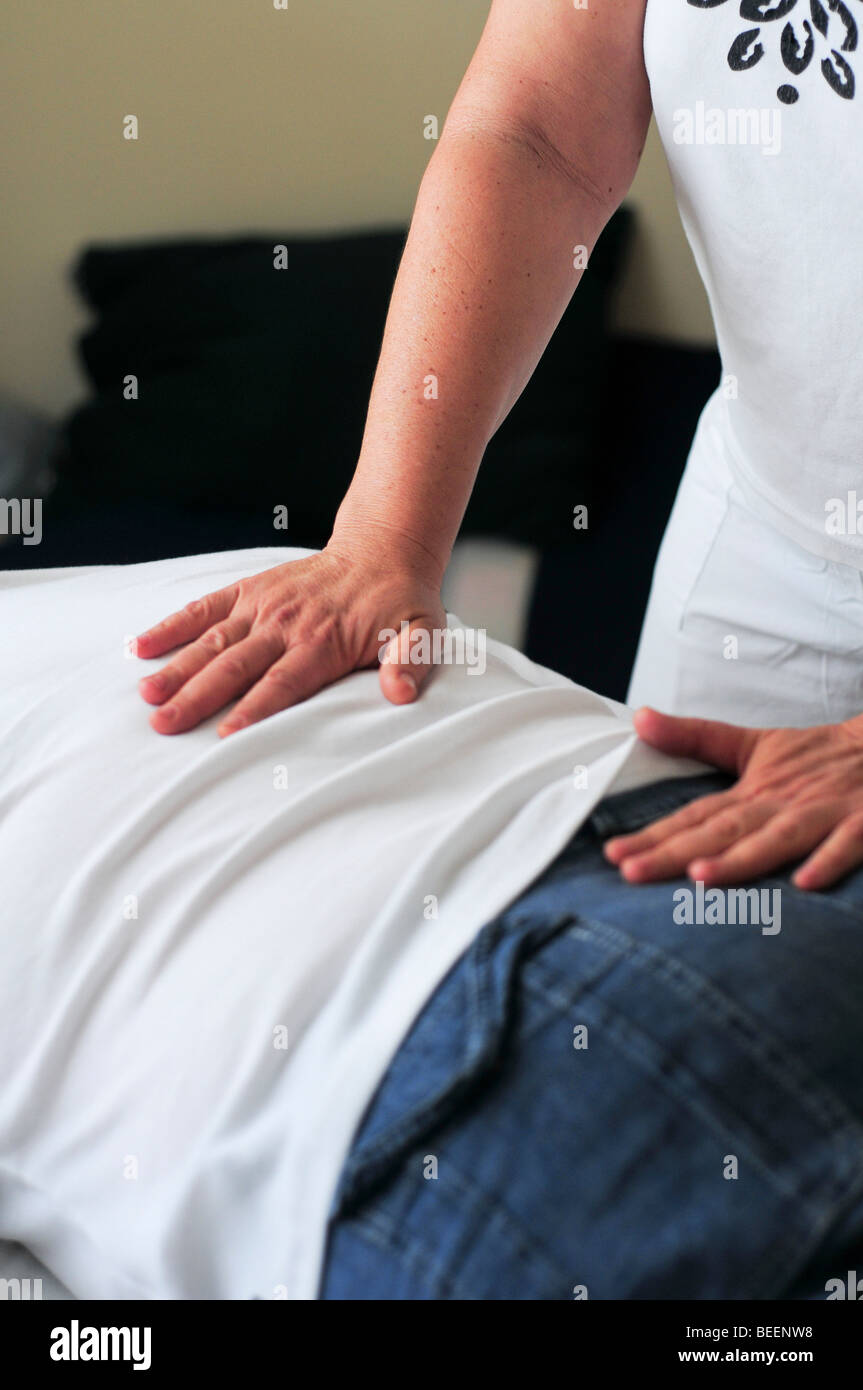 Female masseuse treating a patient Stock Photo - Alamy