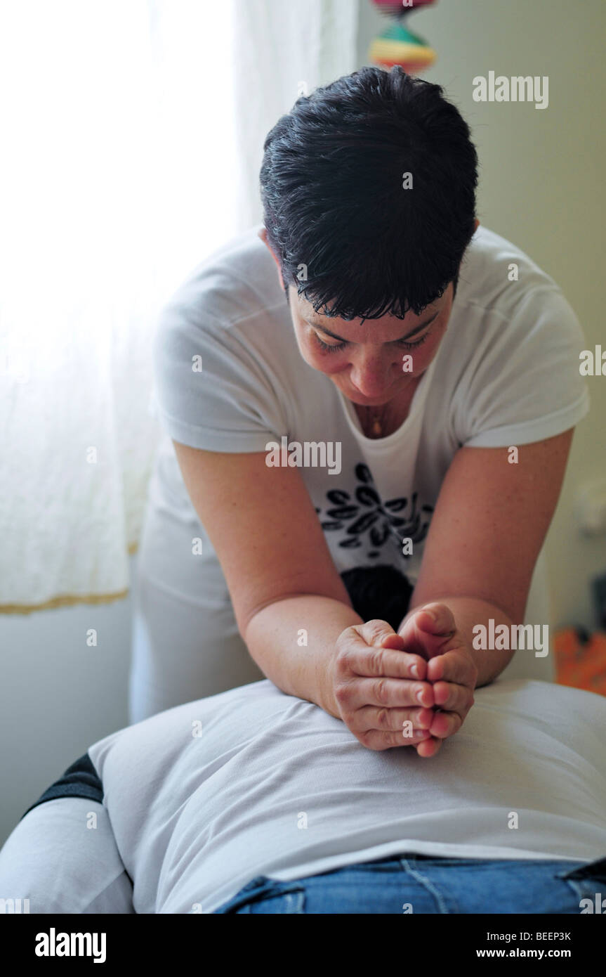 Female masseuse treating a patient Stock Photo - Alamy