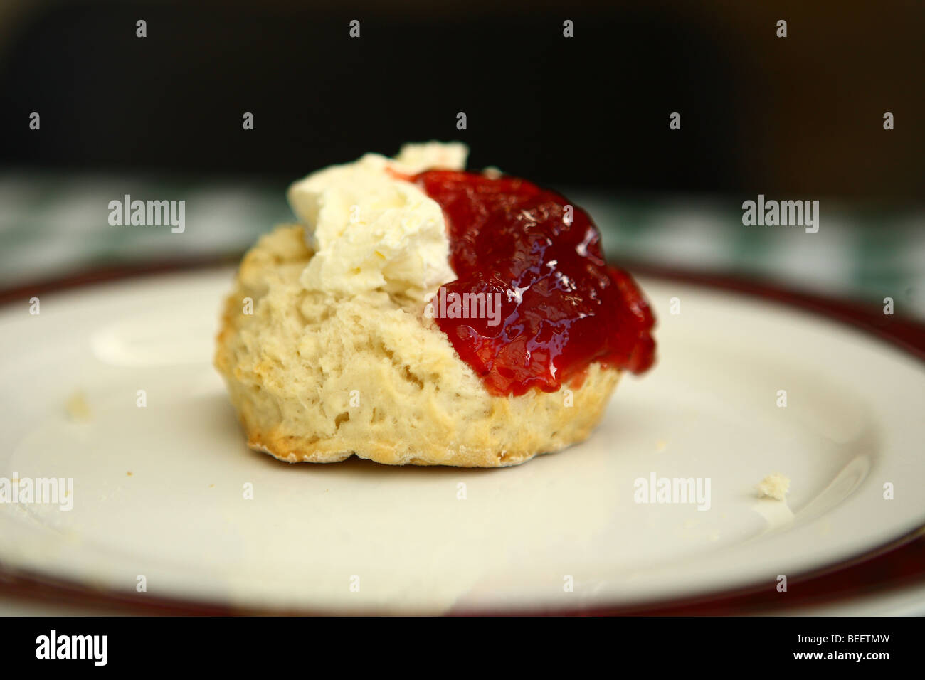 Scone with cream and jam Stock Photo - Alamy