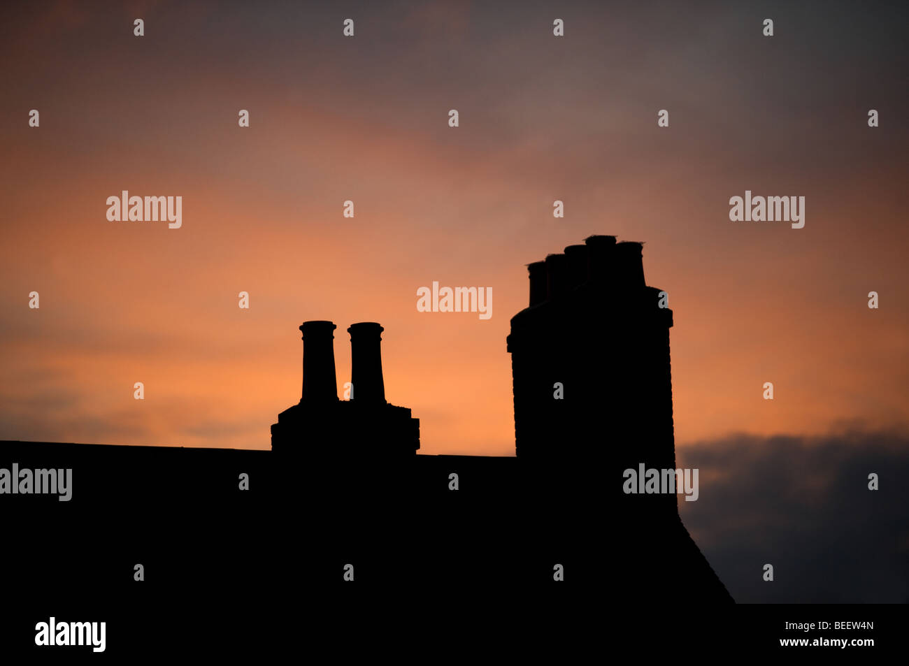 Chimney pots against a red sky Stock Photo - Alamy