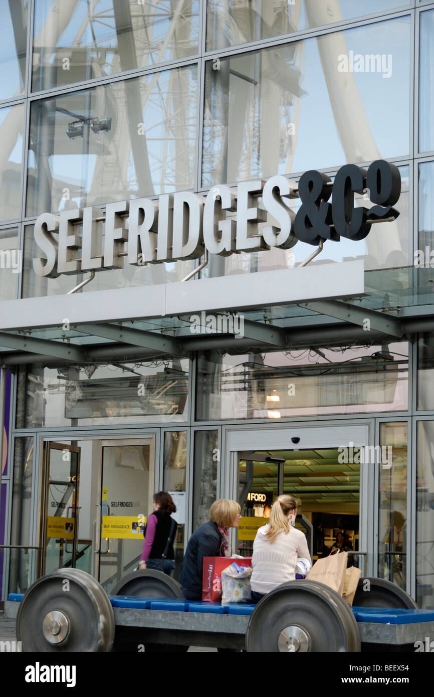 Shoppers sitting outside Selfridges and Co department store in Exchange ...