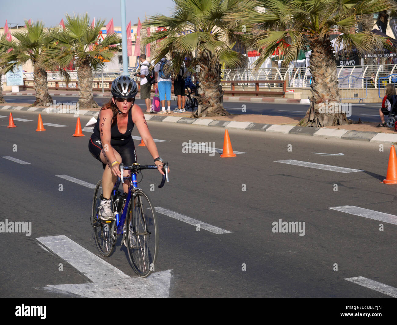 Triathlon competition, Female competitor on a bicycle Stock Photo - Alamy
