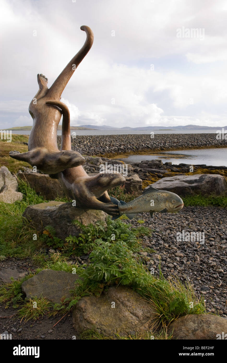 Otters chasing a fish, a sculpture at the Ardmhor Ferry Terminal on the ...