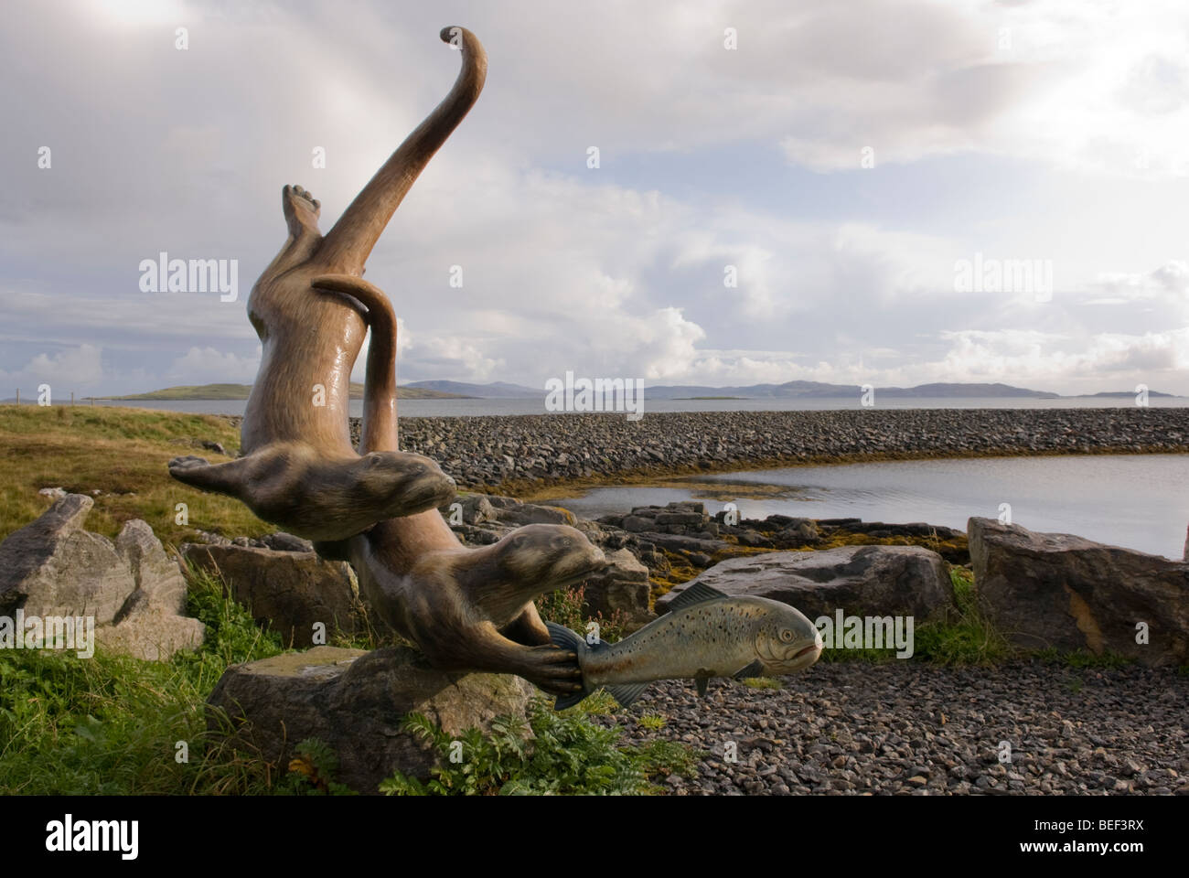 Otters chasing a fish, a sculpture at the Ardmhor Ferry Terminal on the ...