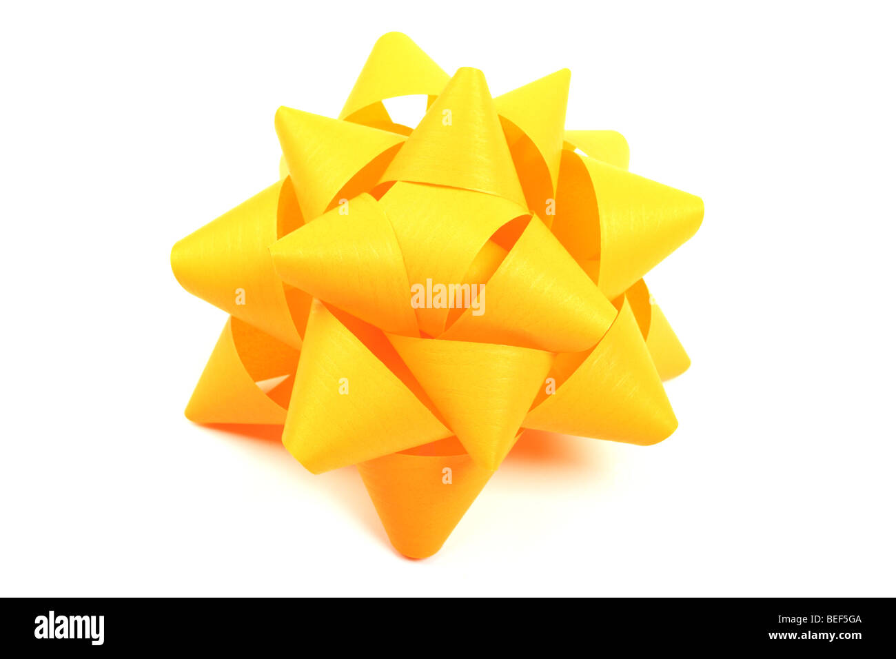 Yellow gift wrapping bow isolated on white background Stock Photo - Alamy