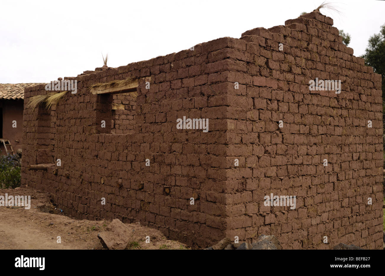 Mud brick house in construction, Raqchi, Peru Stock Photo - Alamy