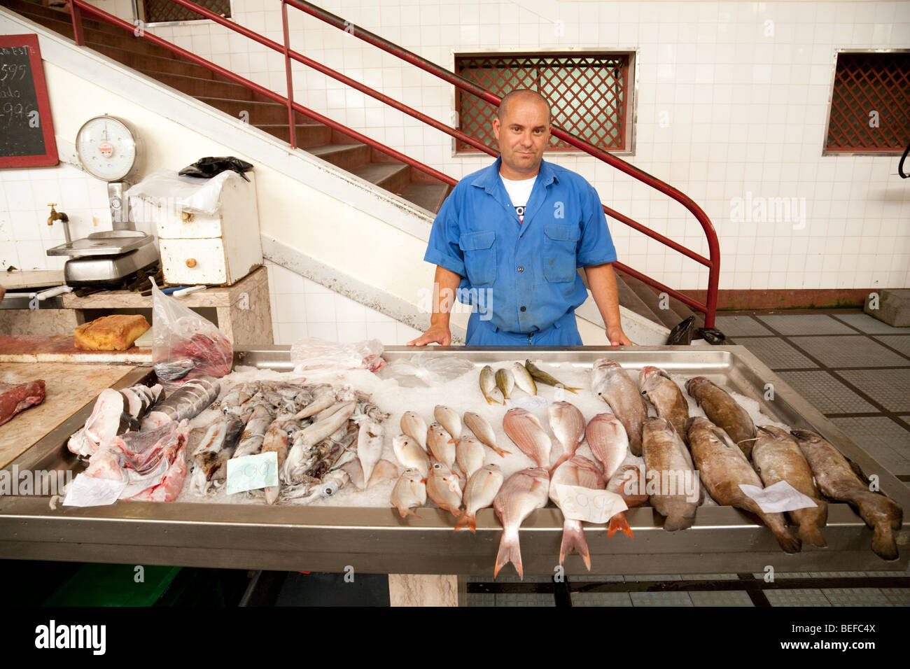 Fishmonger with his fish, The Market, Funchal, Madeira Stock Photo - Alamy