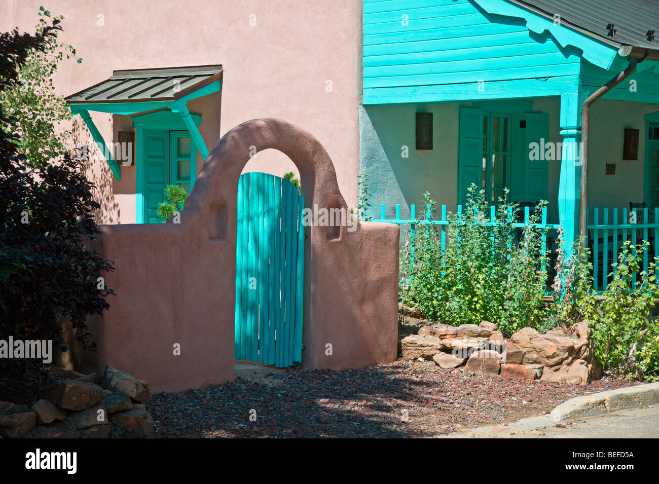 An adobe arch and wooden garden gate in Taos, New Mexico Stock Photo ...