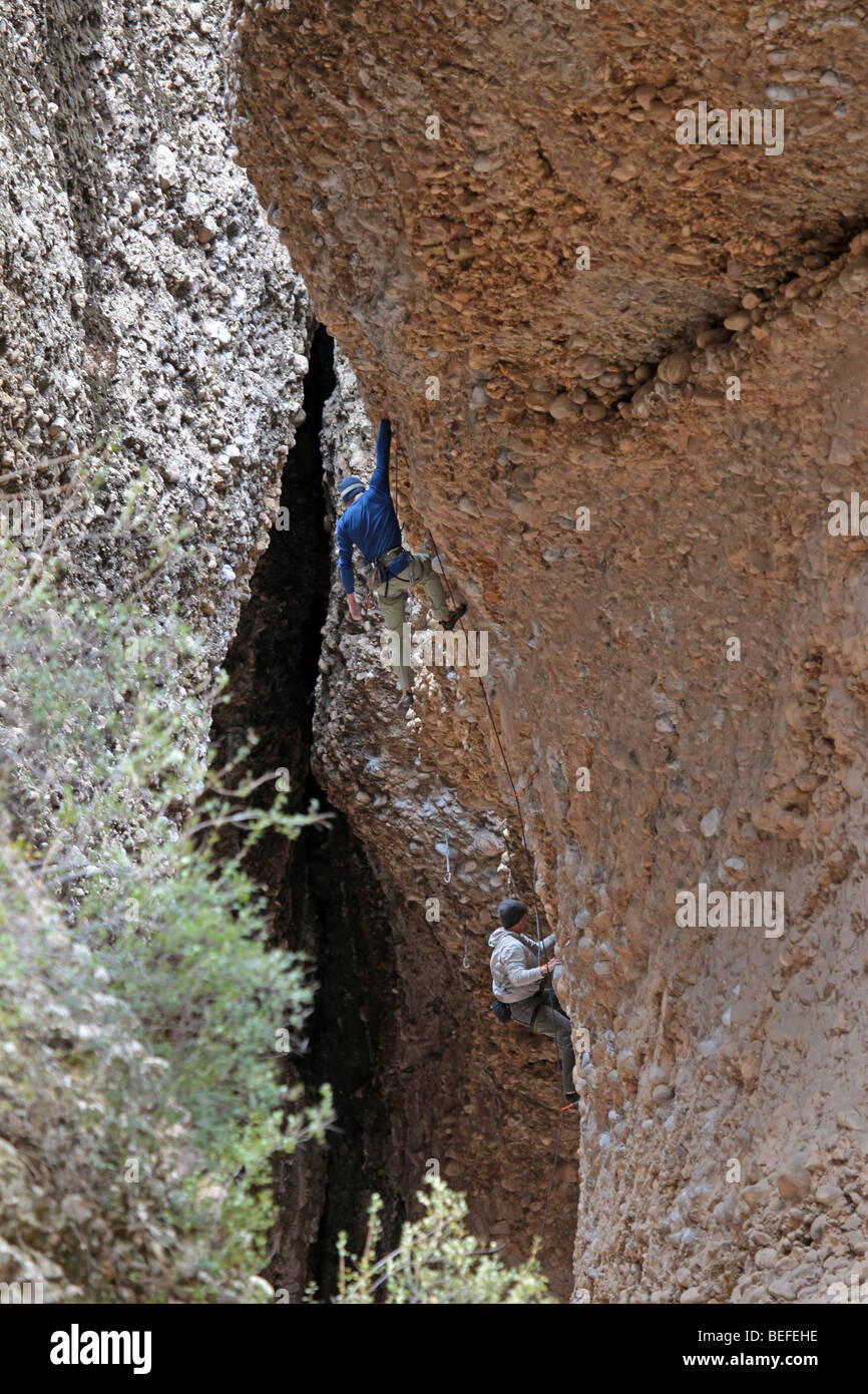 Two rock climber ropes on a high rock ledge in central Utah. Steep ...