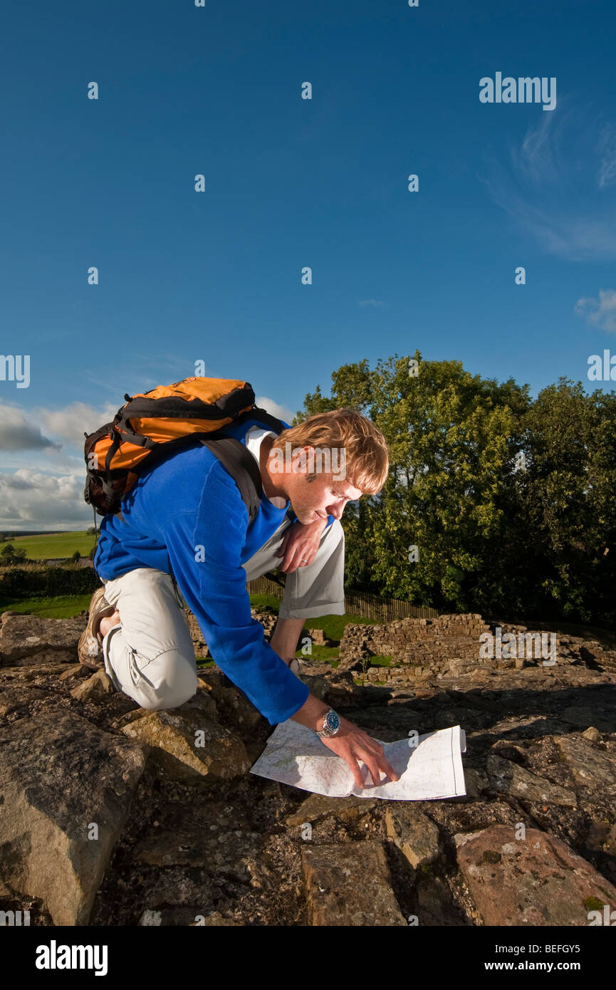 Walker reading a map at Poltross Burn milecastle on Hadrian's wall, at ...