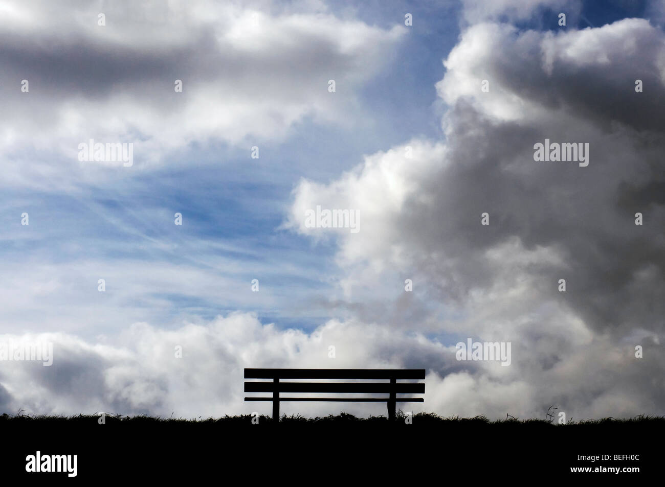 Bench with a dramatic sky Stock Photo - Alamy