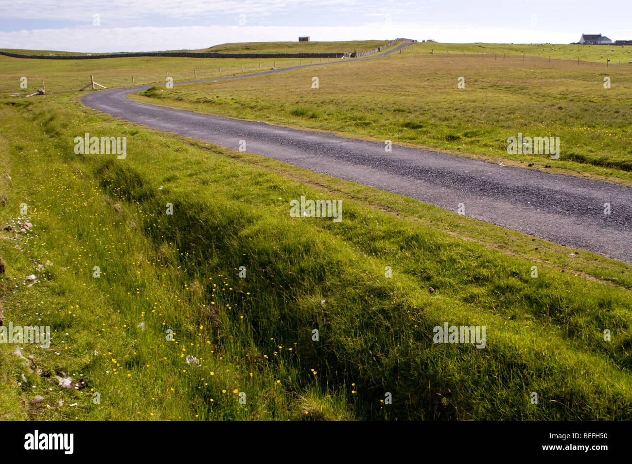 Empty road with ditch on Fair Isle Shetland Stock Photo - Alamy