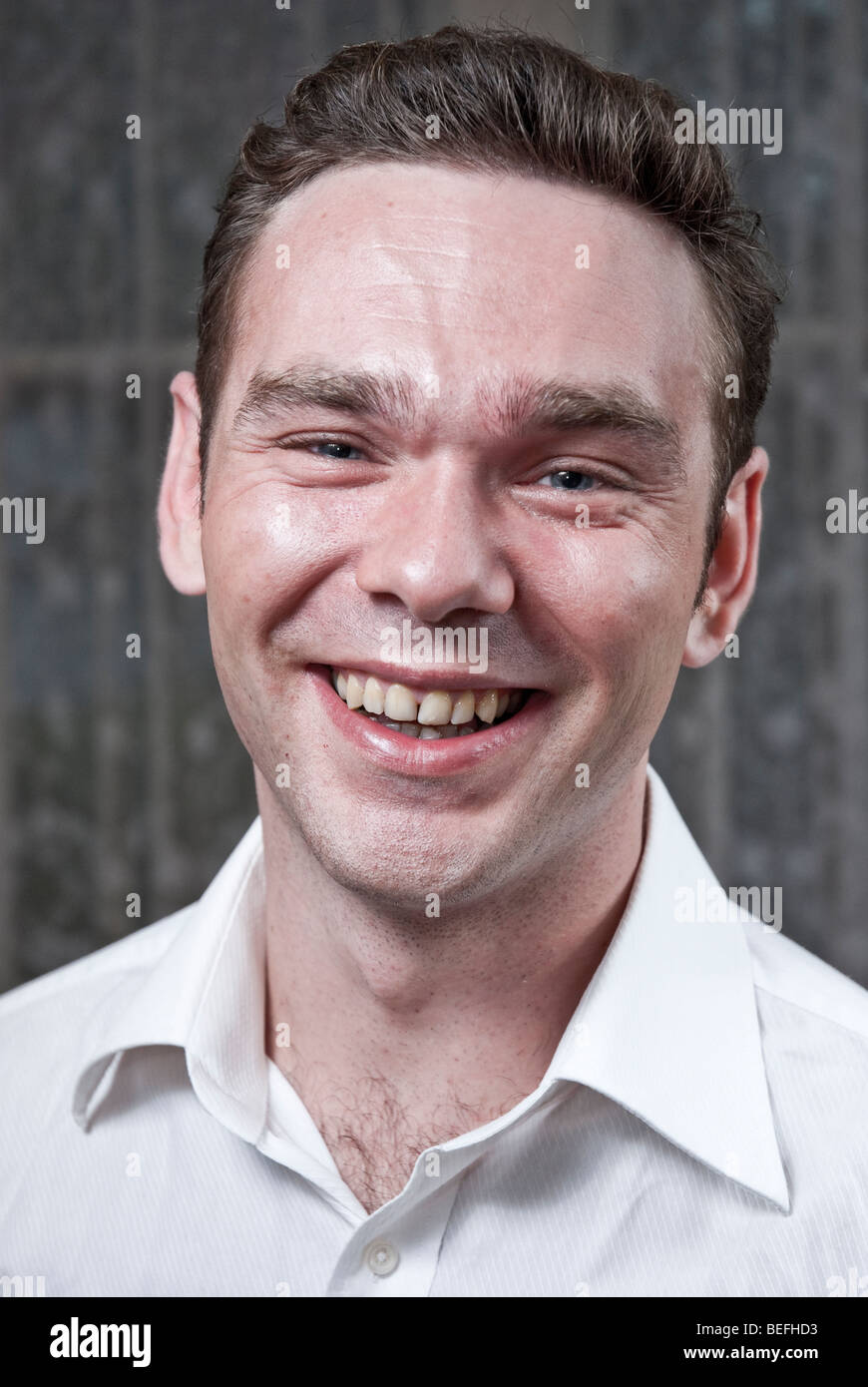 Headshot of young man smiling Stock Photo - Alamy