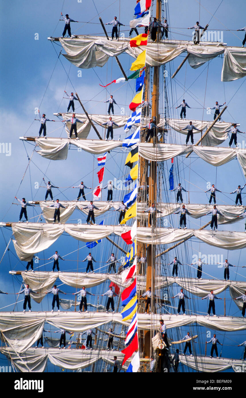 Sailors standing on the masts of the 3 masted schooner "Cvavatemoc" as ...