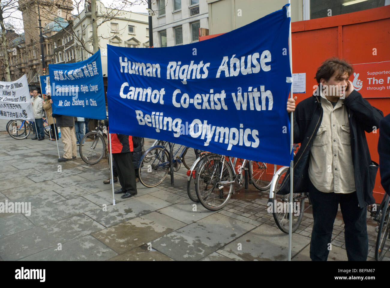Protesters with banners against Human Rights abuse in China on route of ...