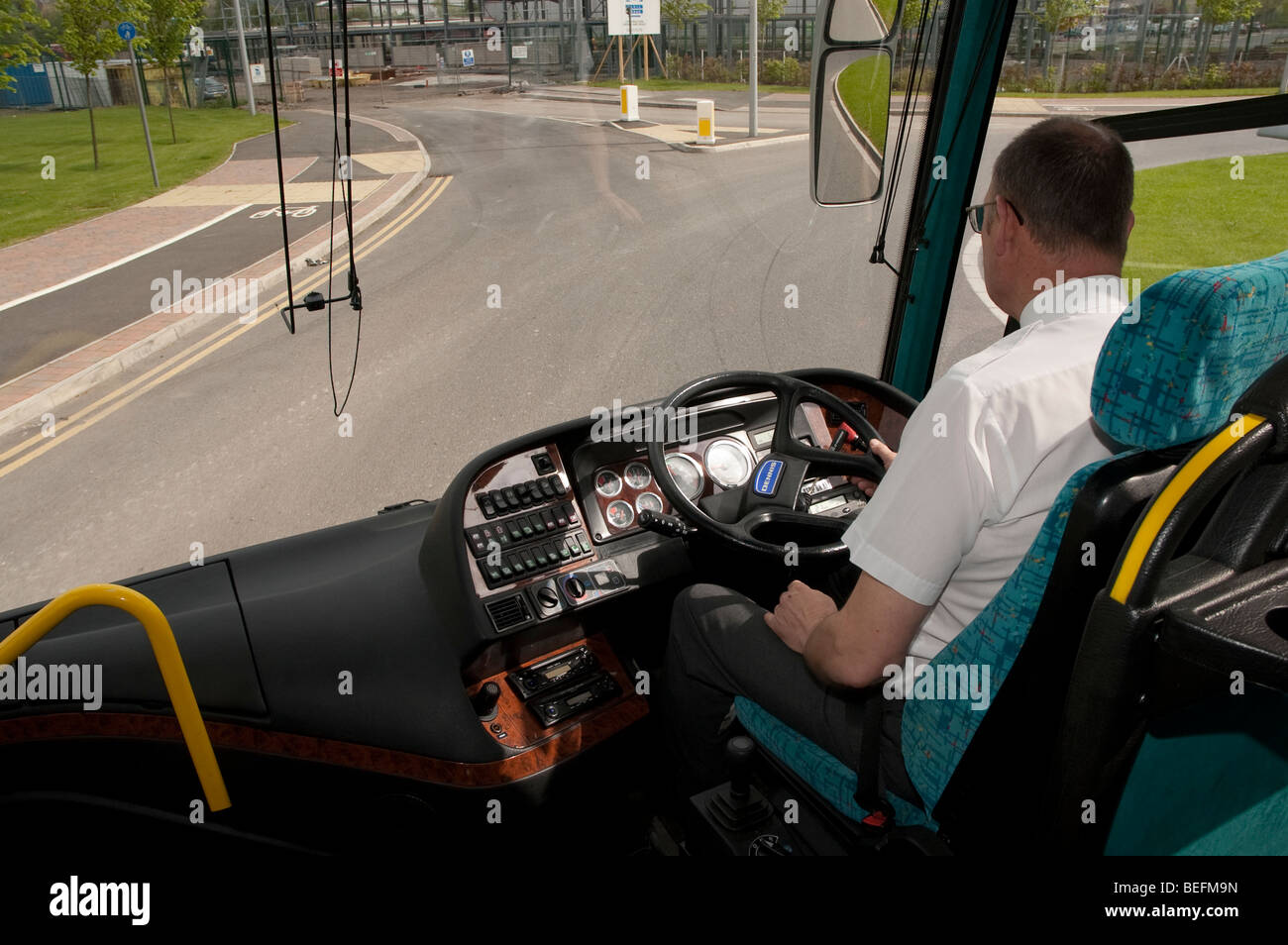Passenger view of coach driver and road ahead Stock Photo - Alamy