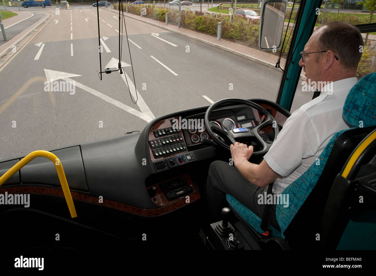 Passenger view of coach driver and road ahead Stock Photo - Alamy