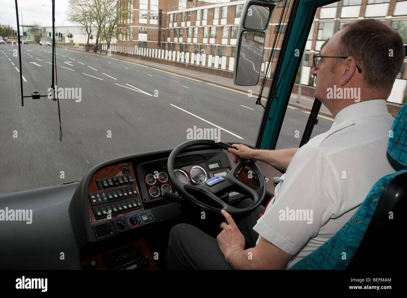 Passenger view of coach driver and road ahead Stock Photo - Alamy