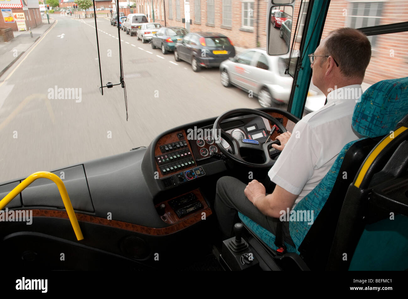 Passenger view of coach driver and road ahead Stock Photo - Alamy
