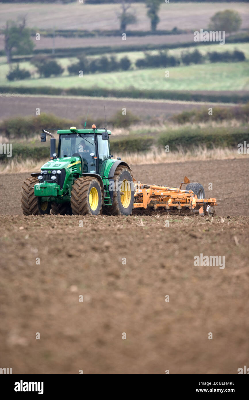 John Deere Tractor Cultivating Land Ready For Drilling Stock Photo - Alamy