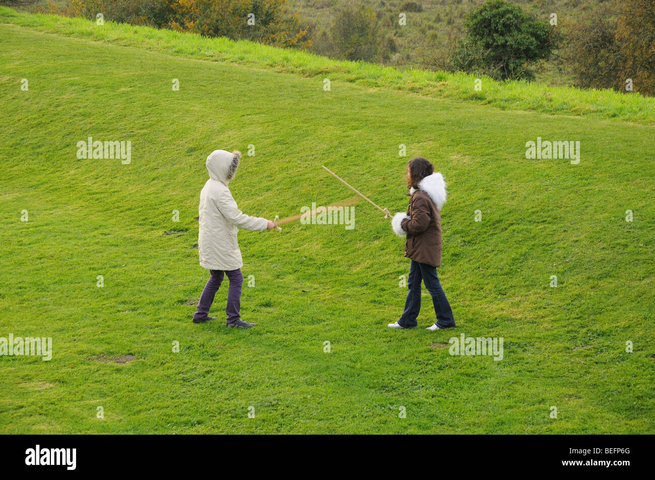 Young children play fighting at Framlingham Castle Suffolk Stock Photo ...