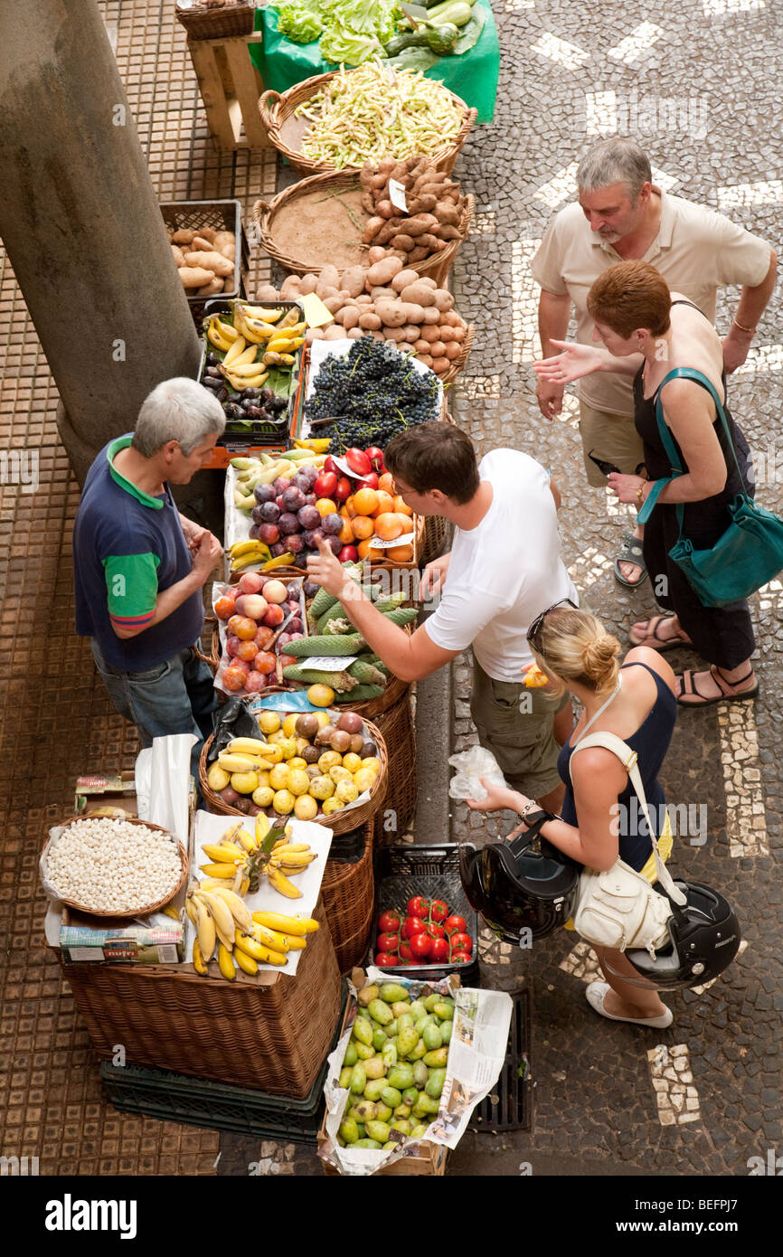 People buying fruit and veg at the covered market in Funchal, Madeira ...