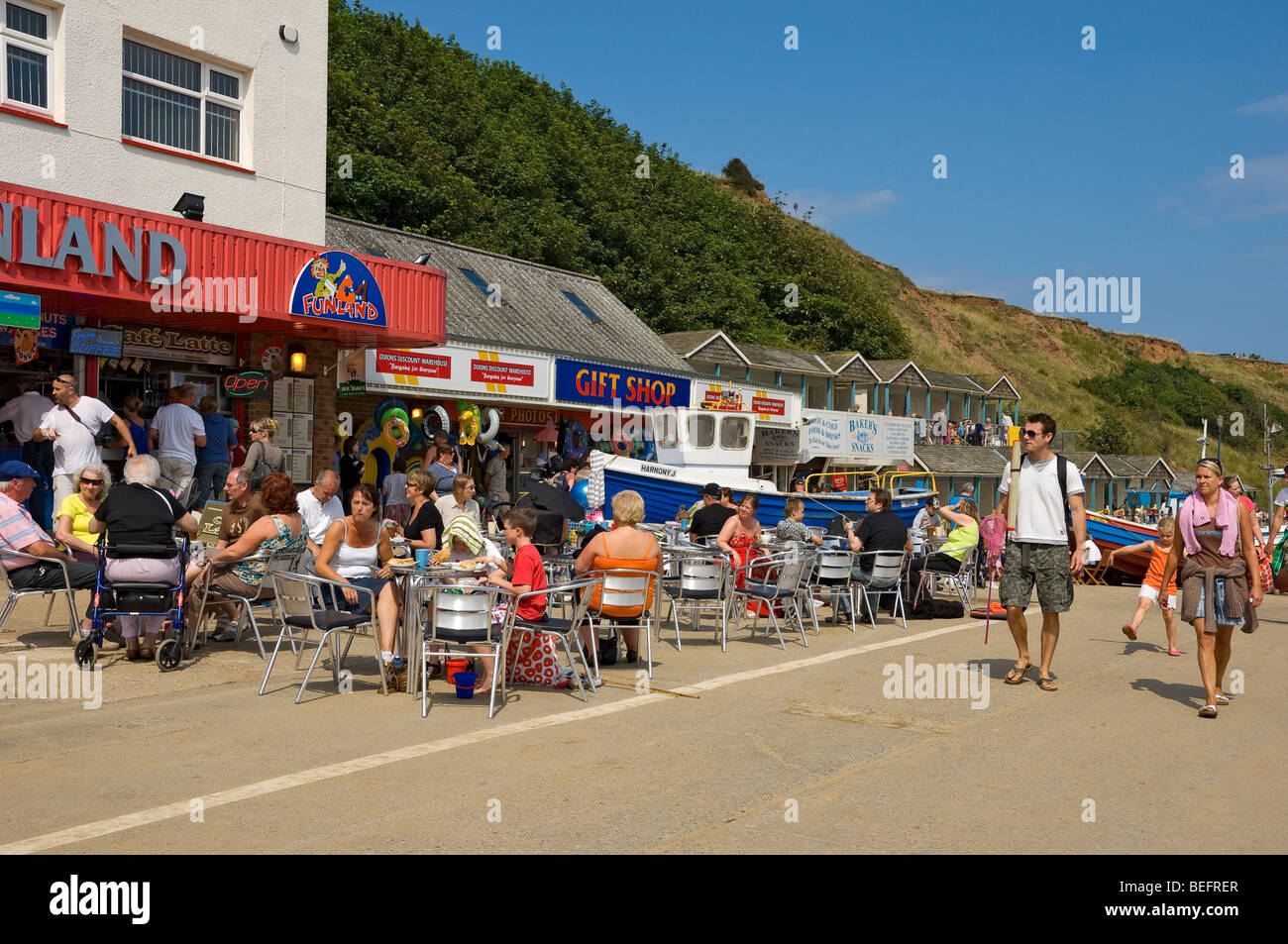 Holidaymakers tourists people visitors on The Coble Landing in summer ...