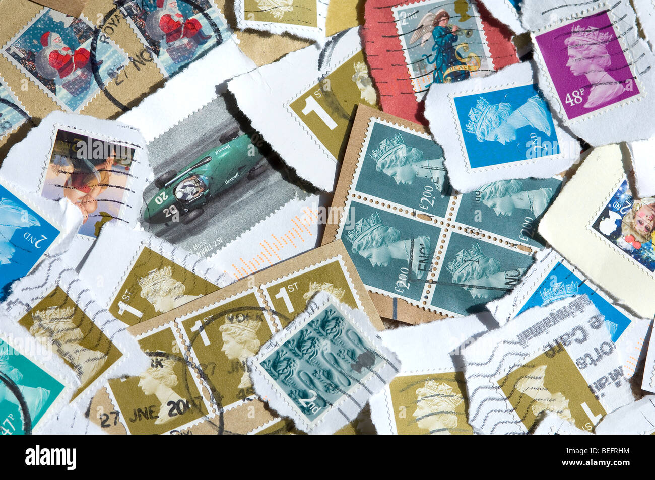 Pile of used British stamps close up Stock Photo - Alamy