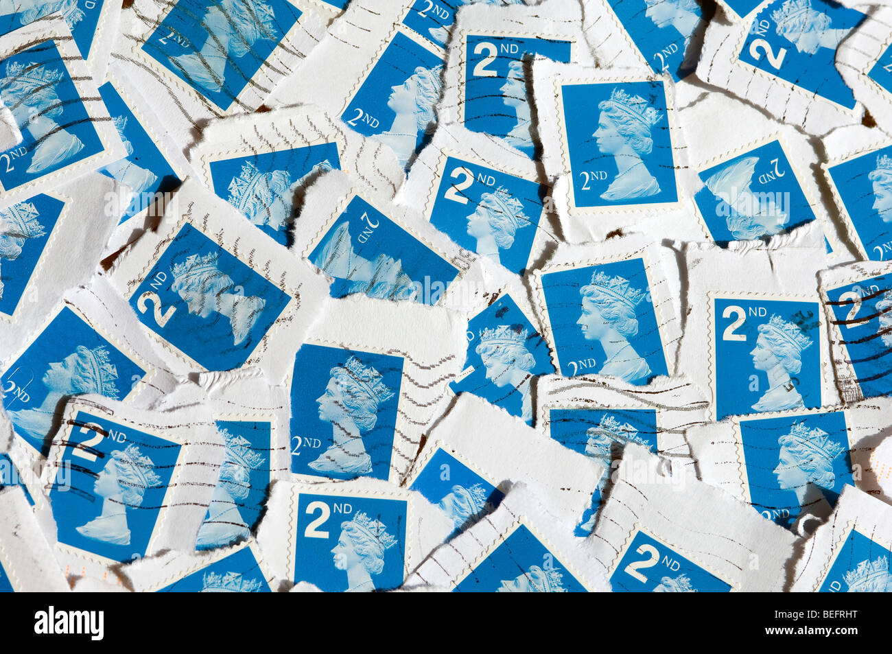 Pile of used second class British stamps stamp close up Stock Photo - Alamy