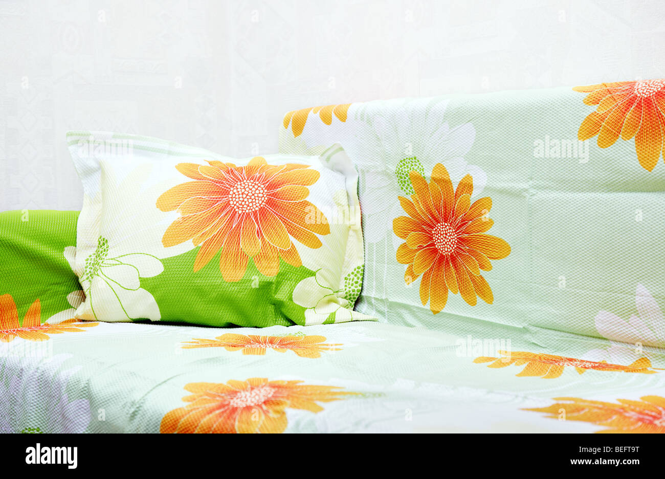 Sofa indoors with colorful bed-clothes Stock Photo - Alamy