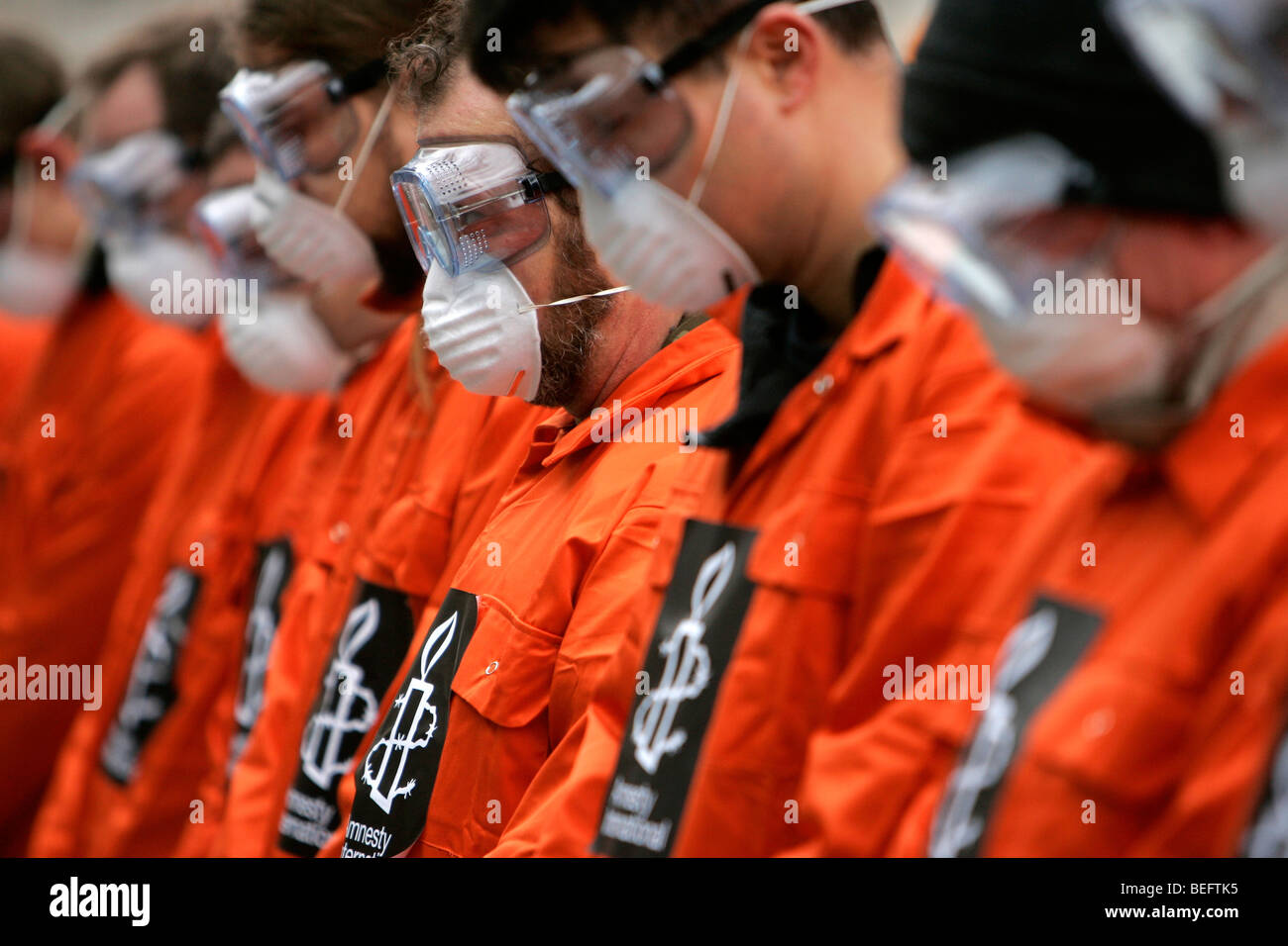 Members of Amnesty International gather to protest outside the U.S ...