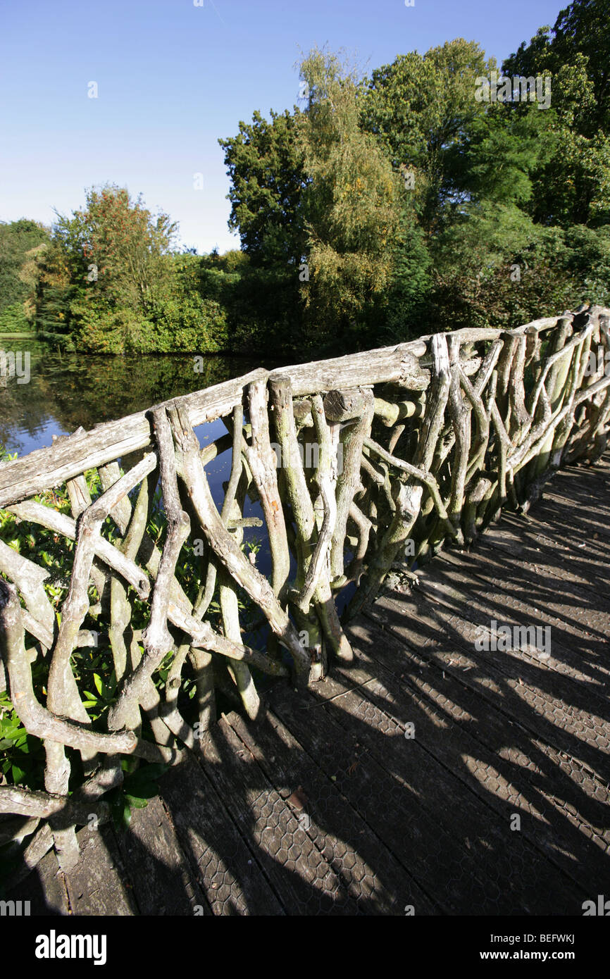 Estate of Tatton Park, England. Wooden wicker style bridge leading too ...