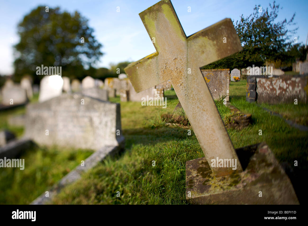 A leaning cross in a graveyard Stock Photo - Alamy