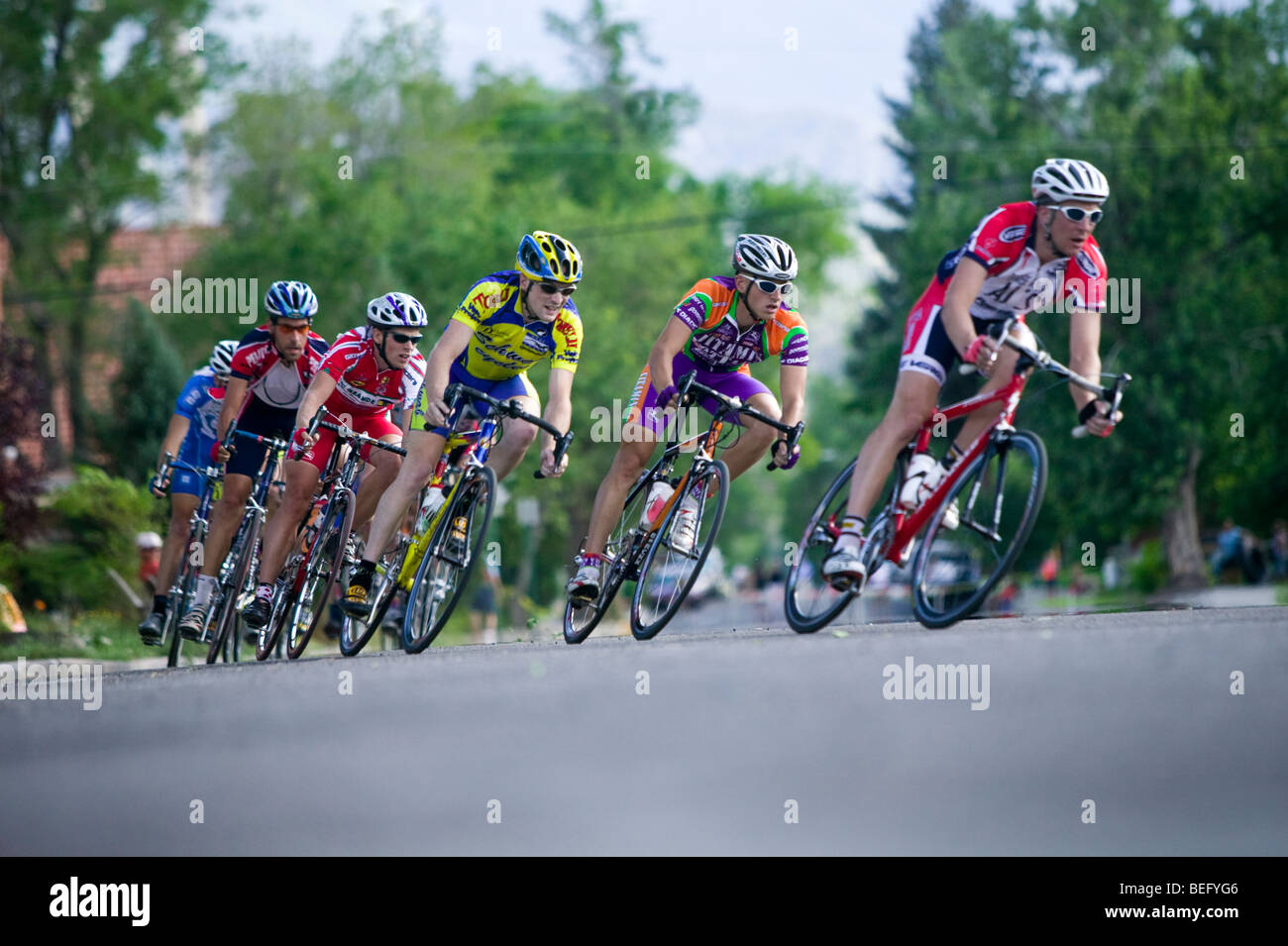 Bicylists race on a closed criterium circuit in the small mountain town ...
